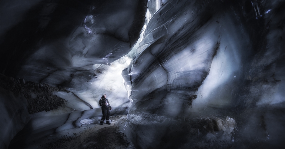 Snowmobile Safari to Ice Cave - Svalbard Adventures - Caving in ...