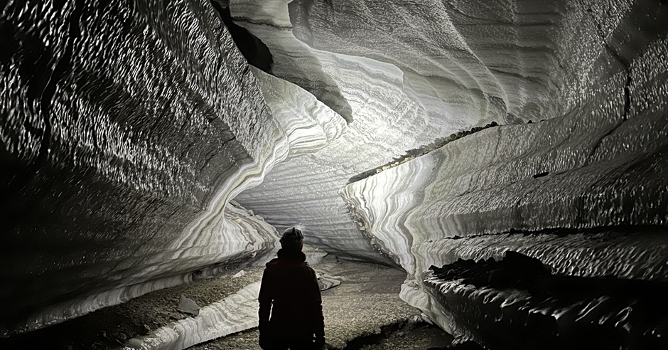 Hike to a magical ice cave in Svalbard - Backyard Svalbard - Caving in ...