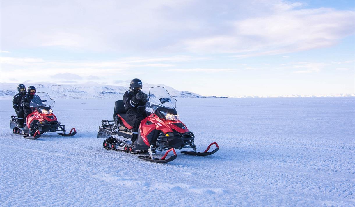 Snowmobile Safari to Ice Cave - Svalbard Adventures - Caving in ...