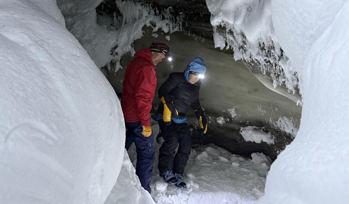 Hike to a magical ice cave in Svalbard - Backyard Svalbard - Caving in ...