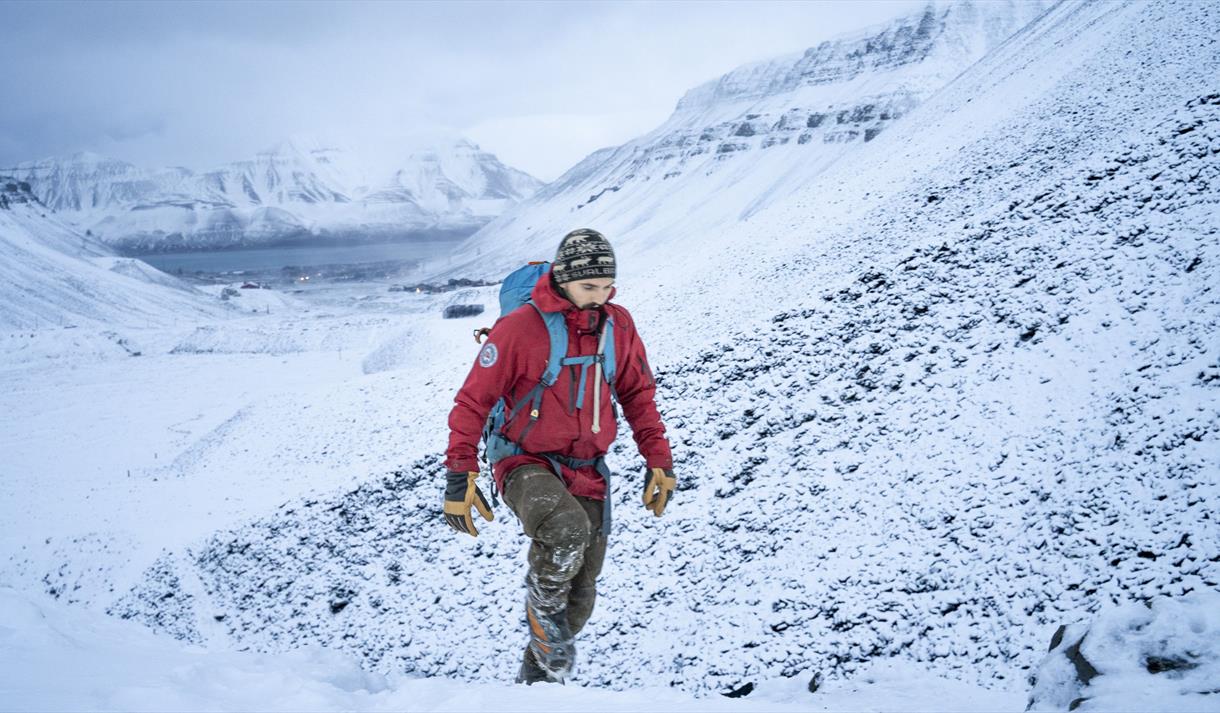 Hike to a magical ice cave in Svalbard - Backyard Svalbard - Caving in ...
